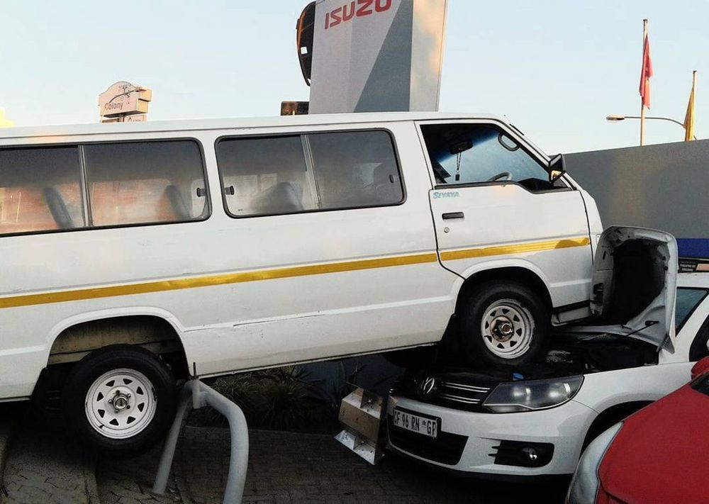 High flyer: taxi crash-lands on car