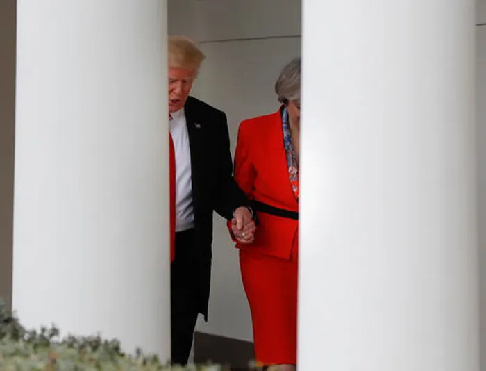 Trump was being a gentleman, UK's May says on holding hands