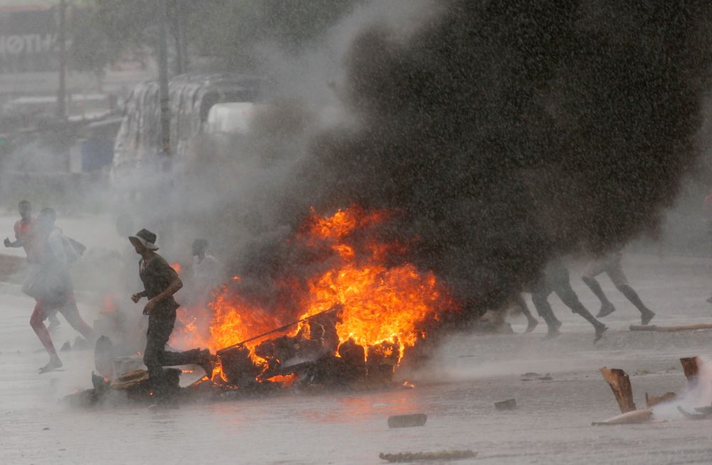 Zimbabwe police fire teargas to disperse crowd queuing for bread