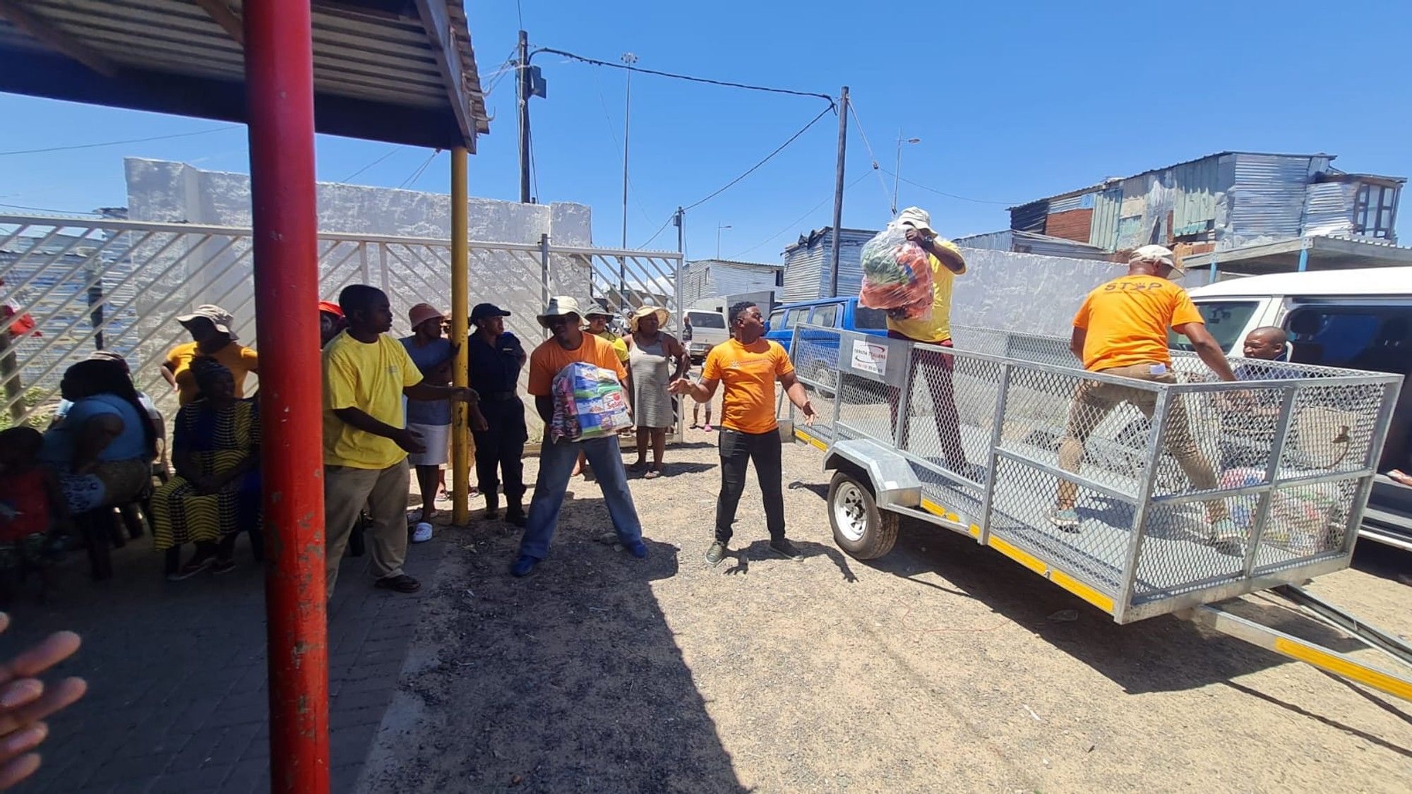 Saints join Ilitha Labantu to help fire victims get to school