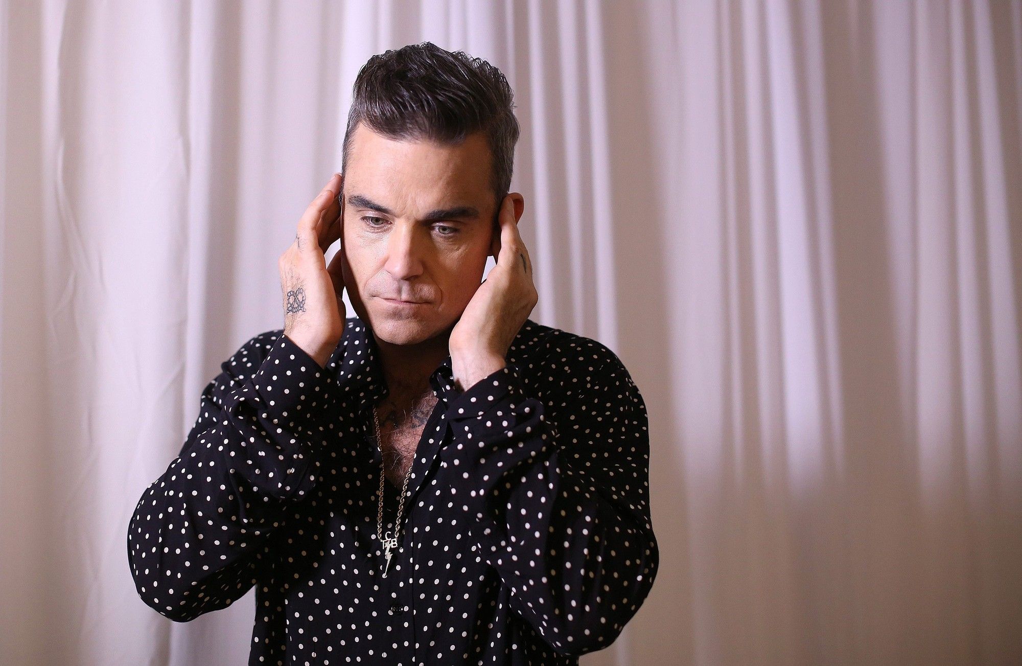 Finally, Robbie Williams shares what his most famous song is really about