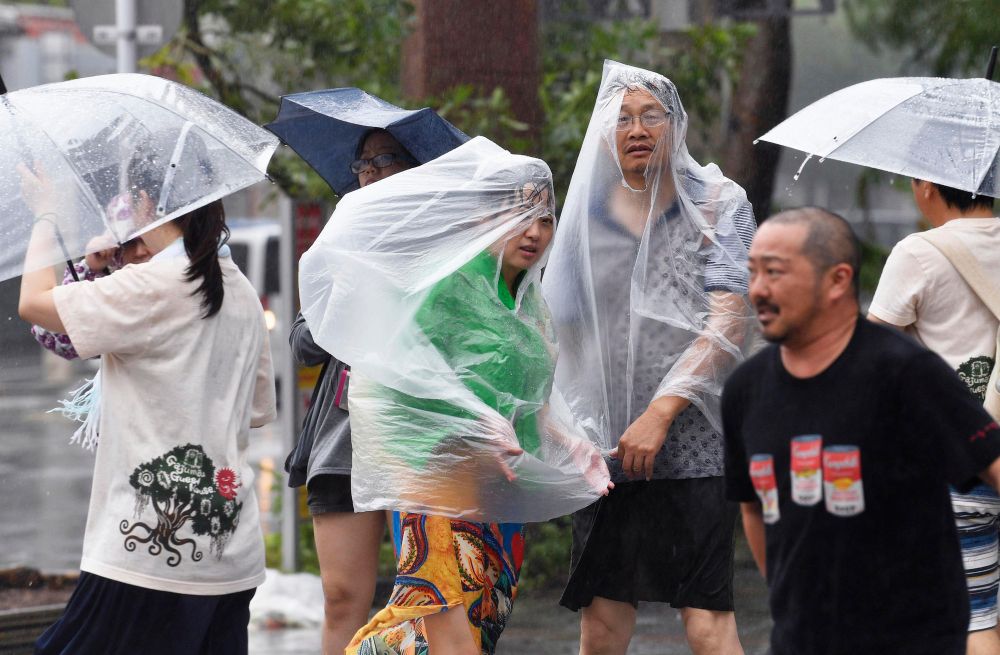 Flights cancelled, trains shut down as typhoon pummels Japan