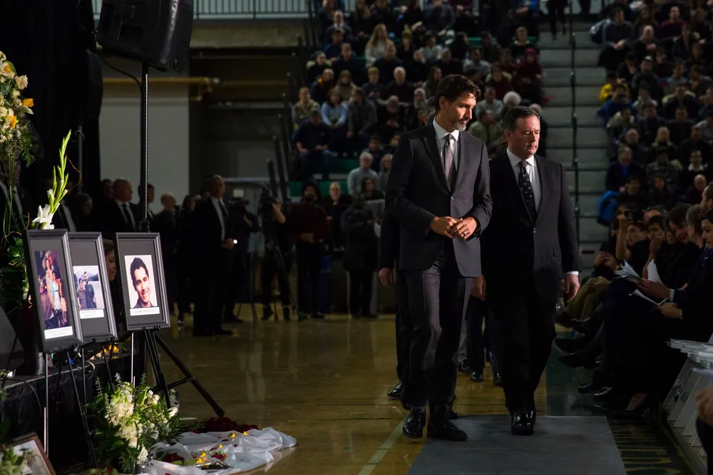 PICS: Canada PM Trudeau vows Iran plane families will get justice