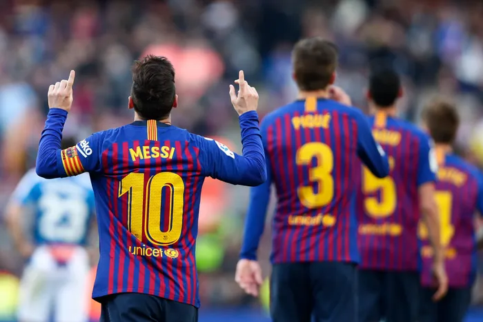 Messi double sends Barcelona 13 points clear