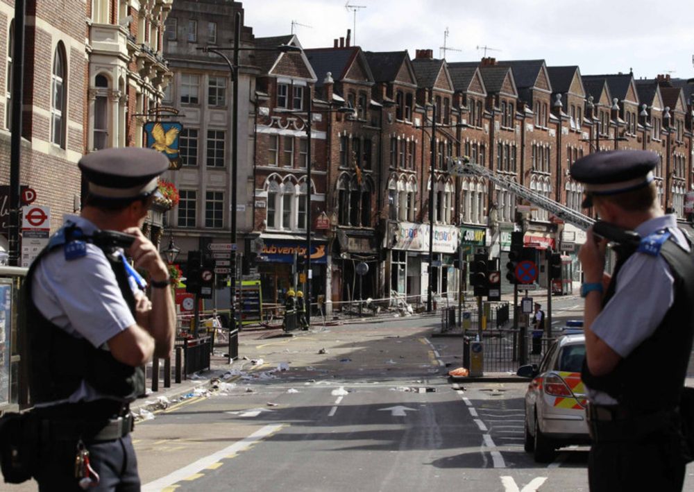Rain, police bring calm to UK