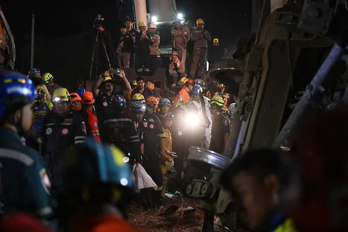 PICS: Crane collapses onto train in Thailand, killing 32