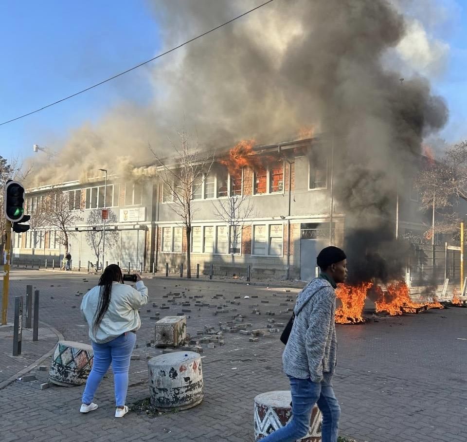 Two arrested for public violence amid evictions and fire at Germiston ...