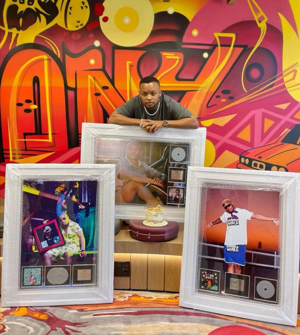K. O presented with three platinum plaques on his birthday