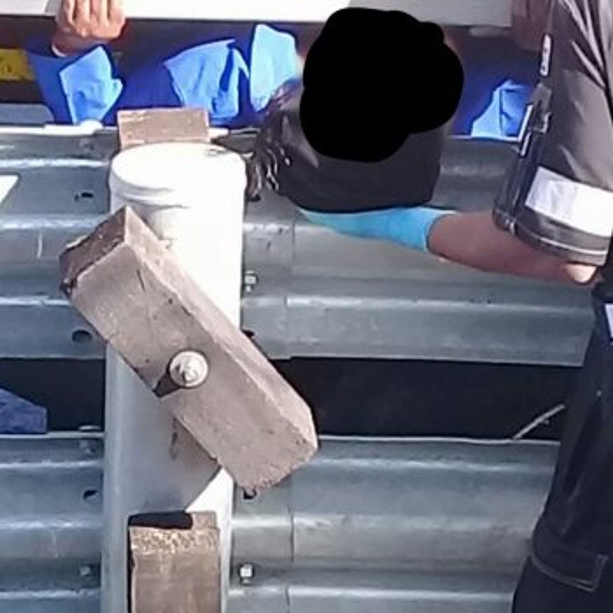 Pic: Two people survive being pinned between armco barrier and truck