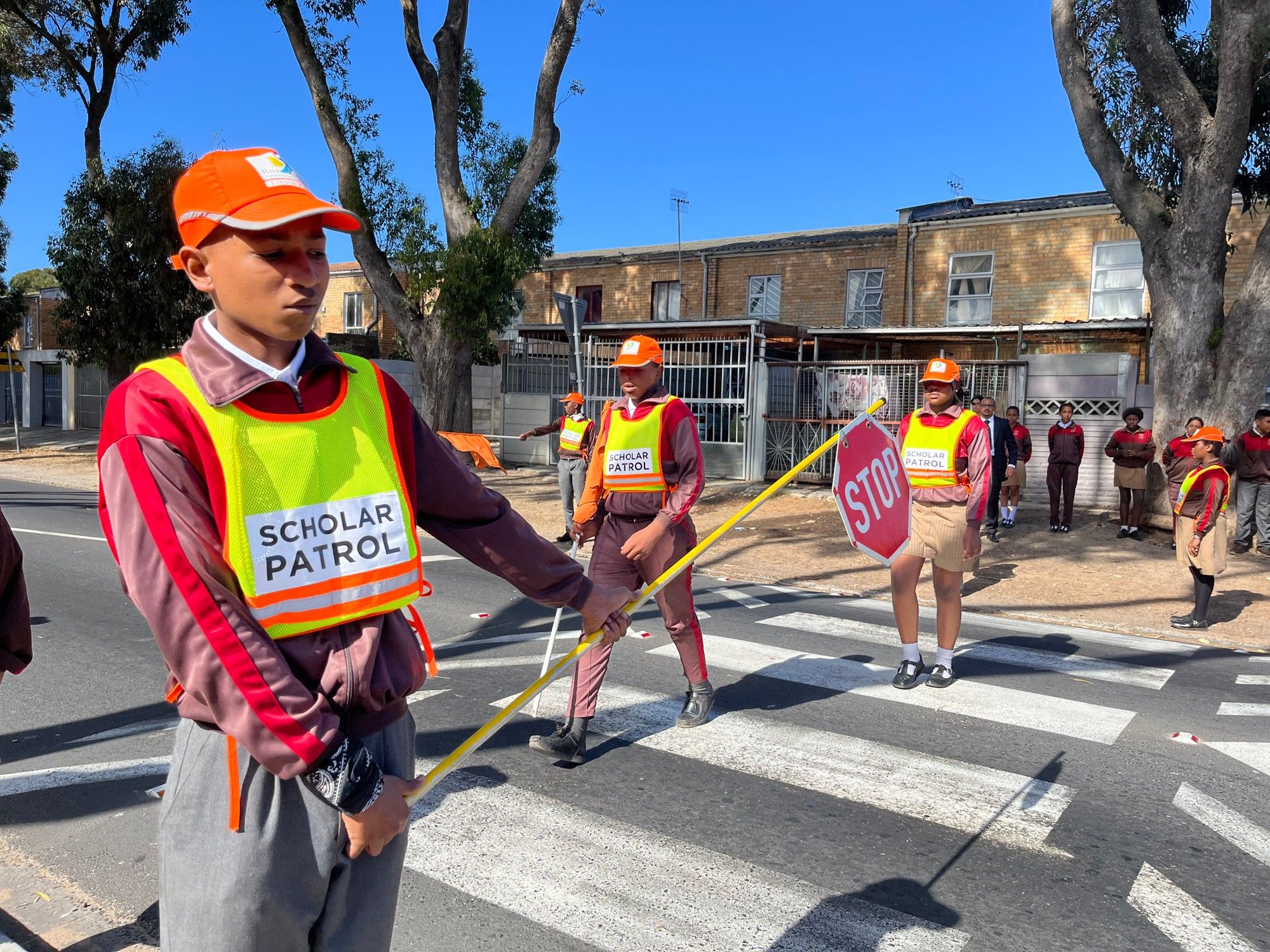 Westridge scholar patrol hands over the board