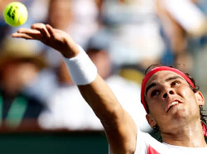 Djokovic squeaks through, Nadal coasts home