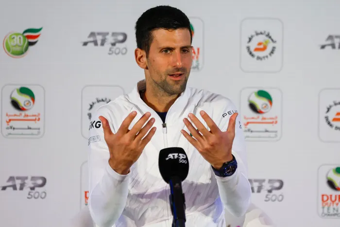 Novak Djokovic finally gets season underway in Dubai to loud cheers