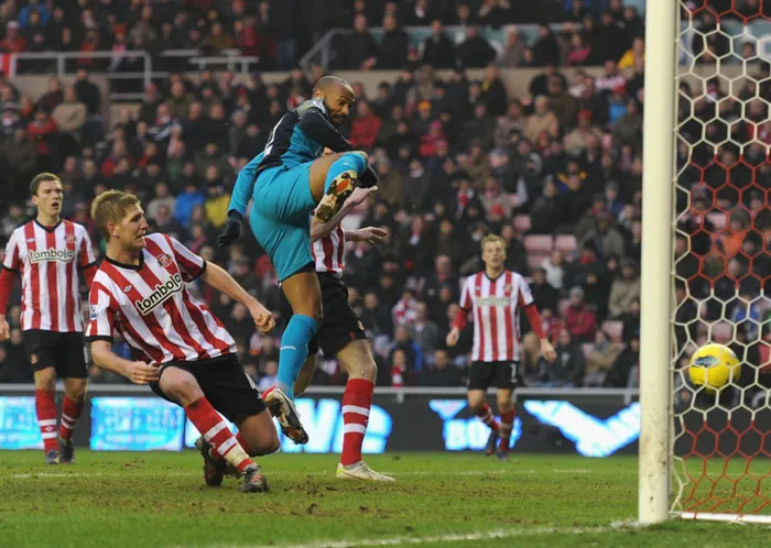 Henry steals show for Arsenal