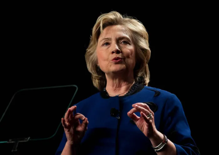 Clinton defends Obamacare