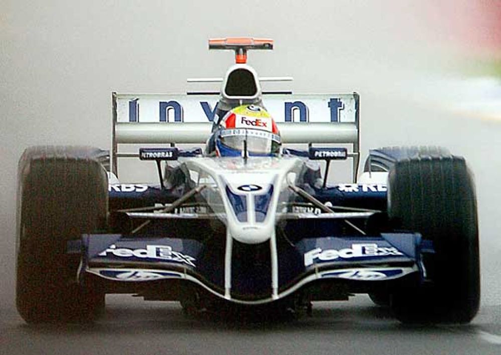 Webber comes off track singing in the rain