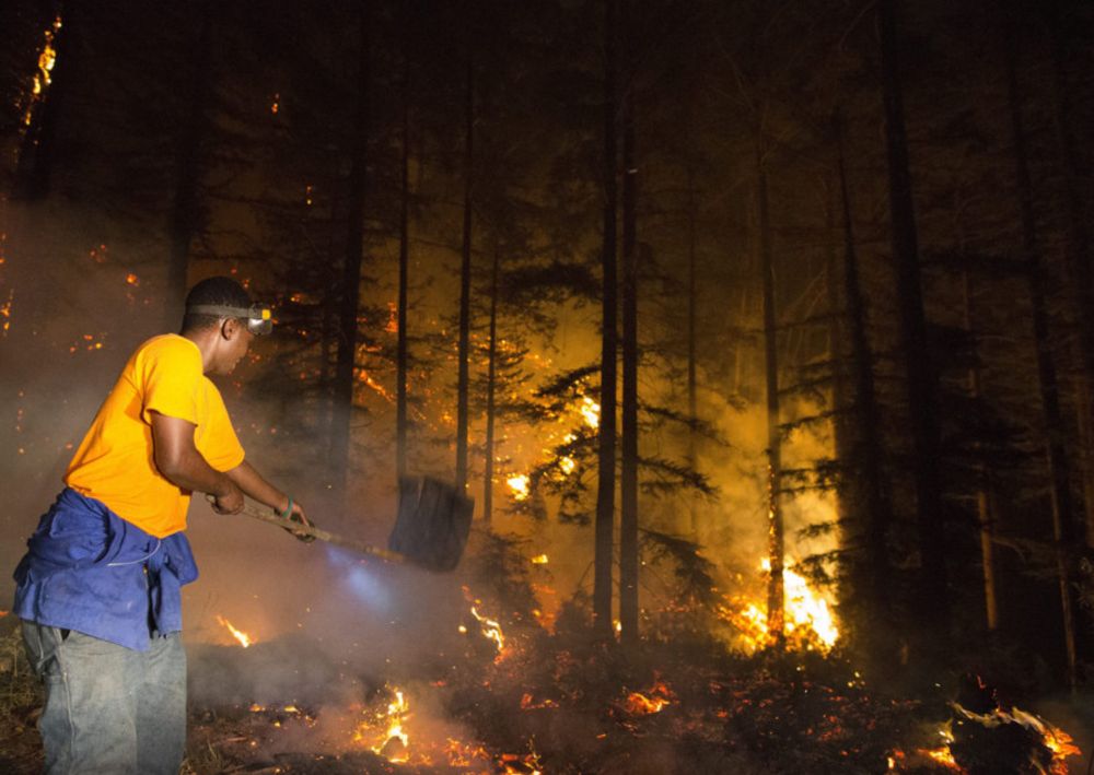 Battle to contain huge fire rages on