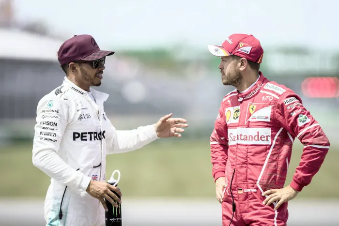 Hamilton laughs off speculation about Vettel move