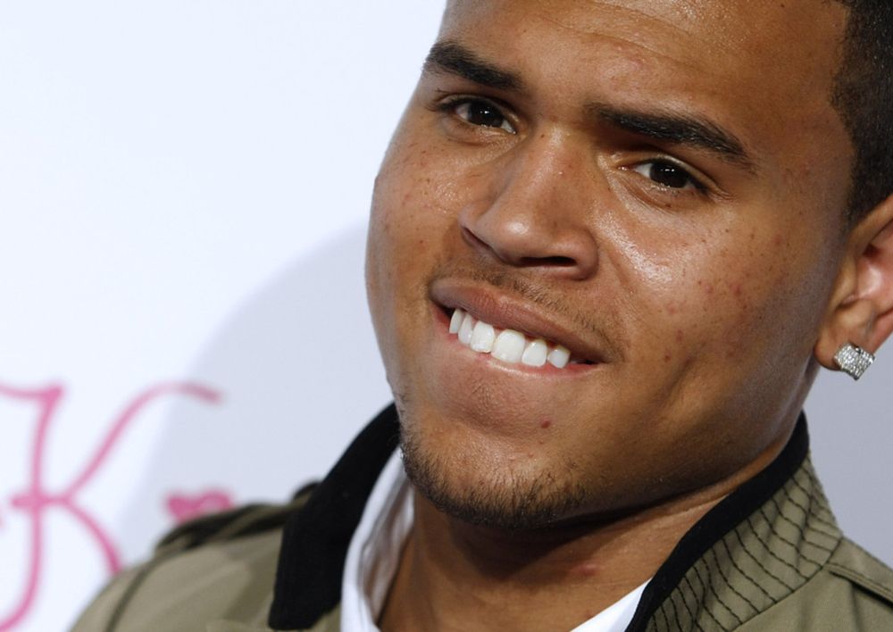 Brown wants restraining order eased