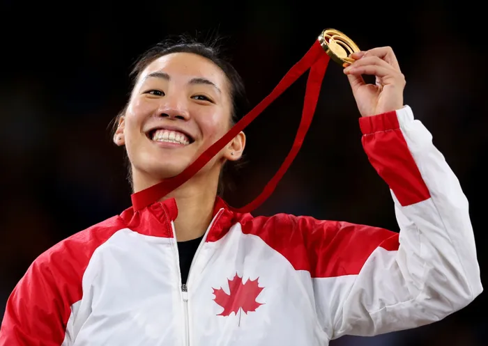 Canada’s Li wins gold, makes history