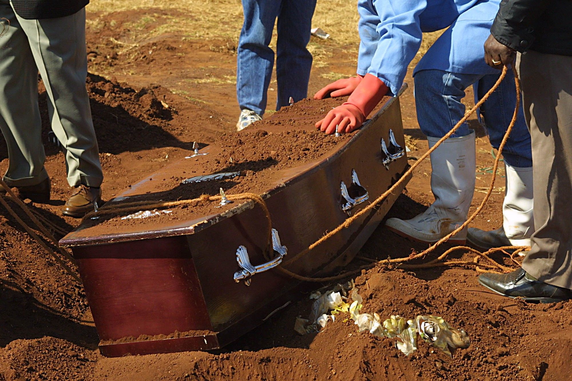 Caught in the act: Two found digging up grave of teenager buried last month