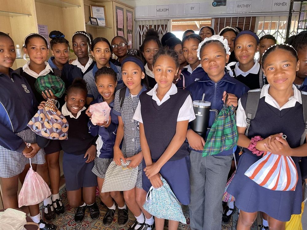 Helderberg Rotary Anns distribute sanitary pads at Raithby Primary School