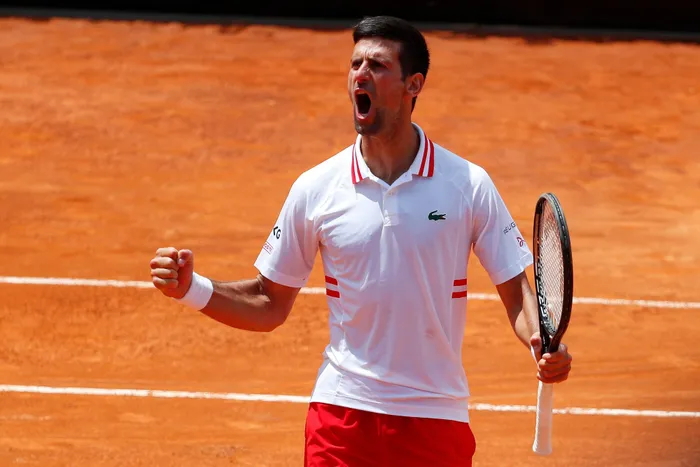 Novak Djokovic battles to victory as he warms up for French Open