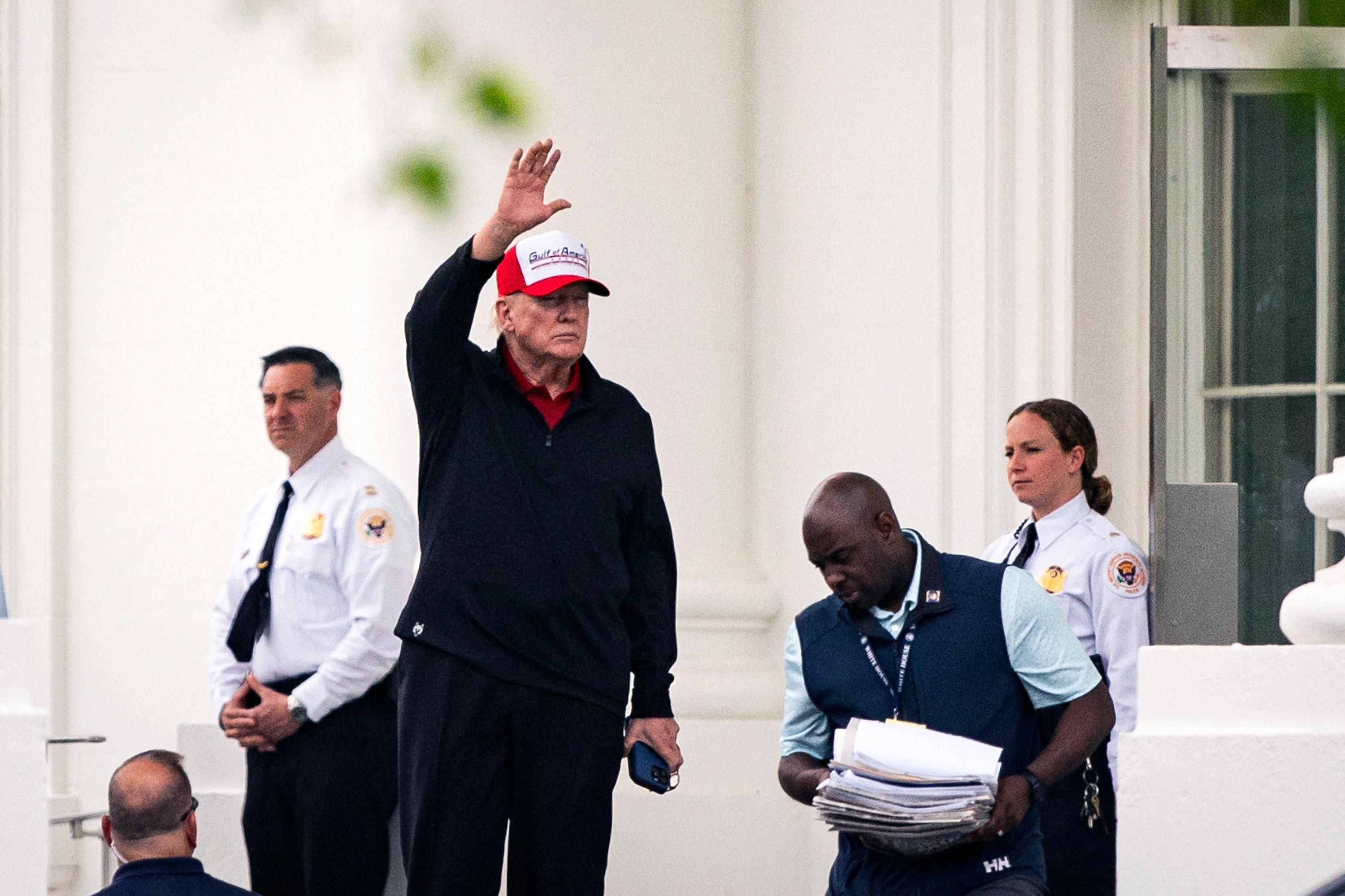 Gold hits record, dollar drops as Trump tariff fears dampen sentiment