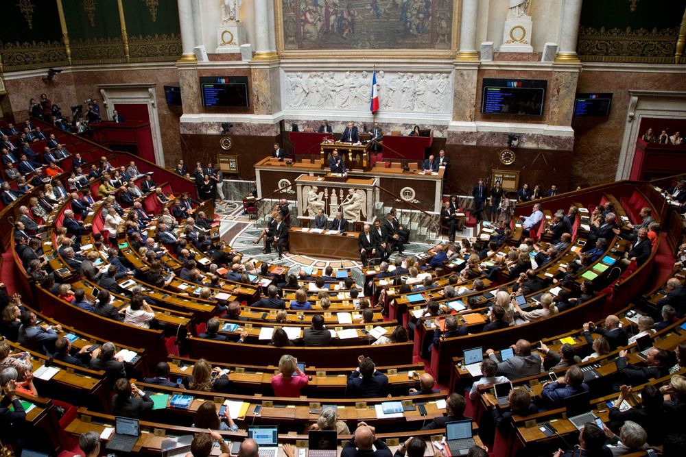 Macron survives two no-confidence votes amid protest assault scandal