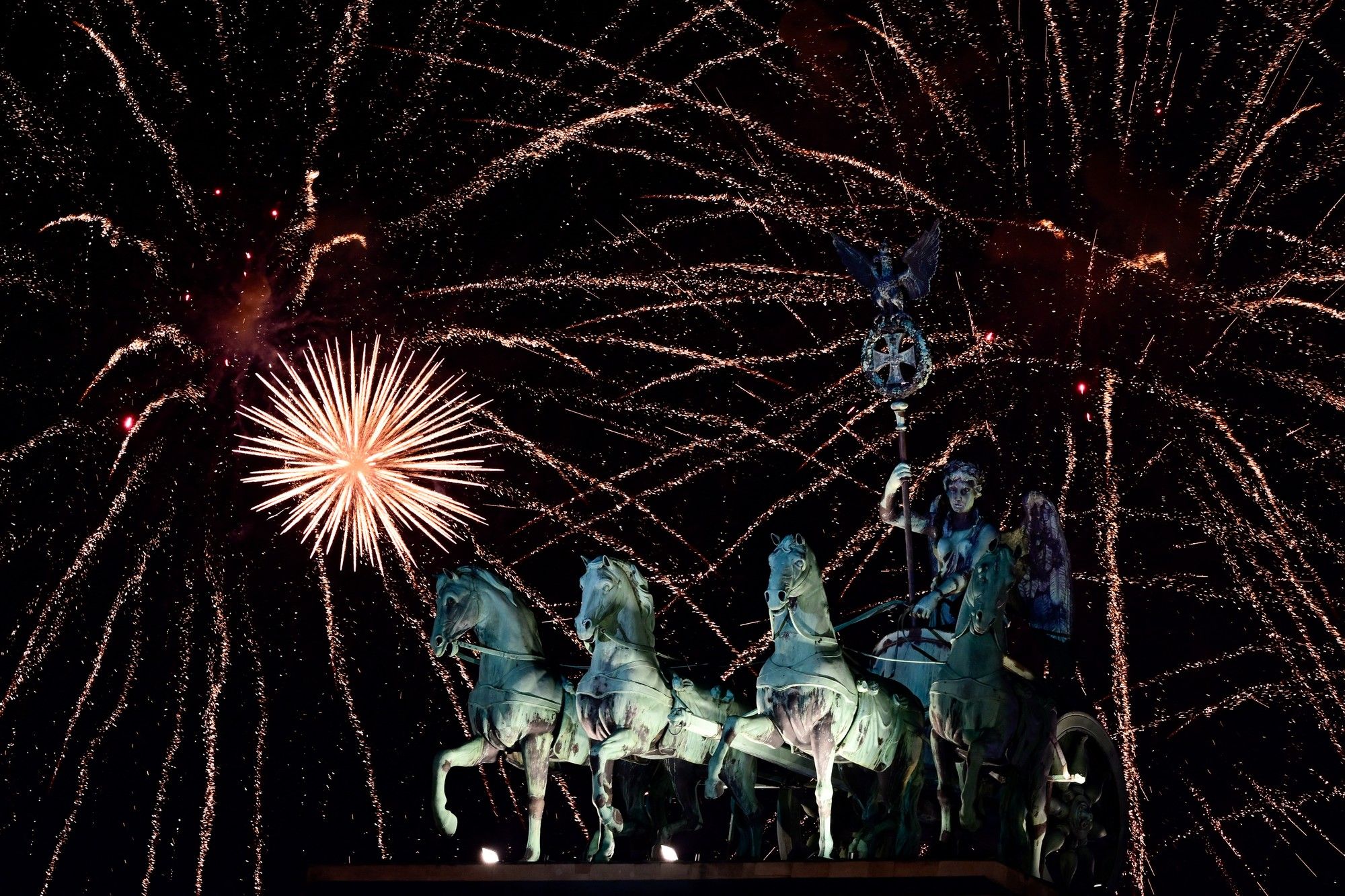 Fireworks, weapons light up skies as world enters 2024