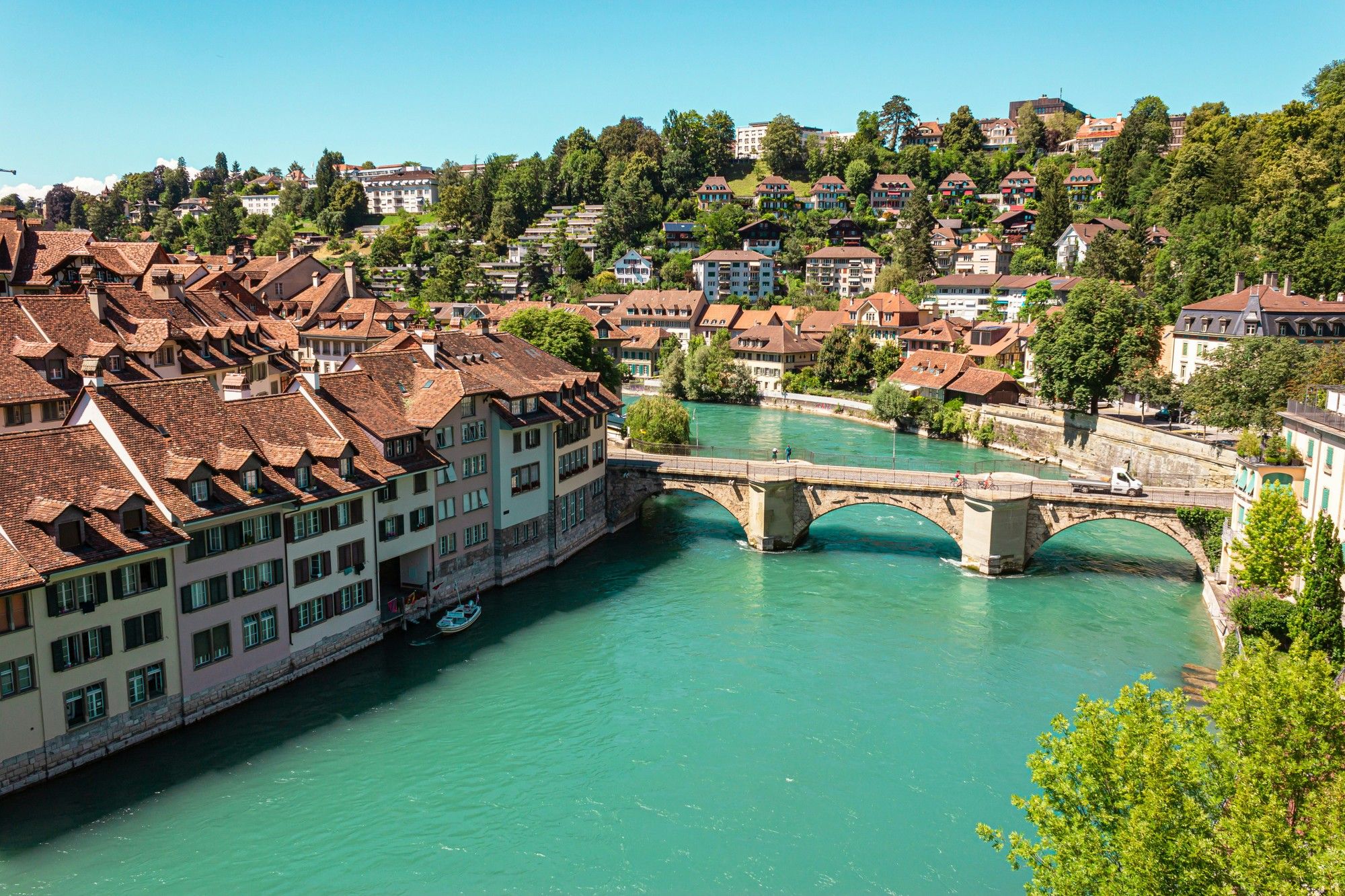 WATCH: Swiss residents in Bern float down the Aare River to get around ...