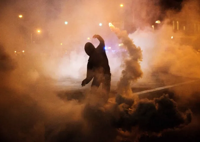 Baltimore woman slaps rioting son
