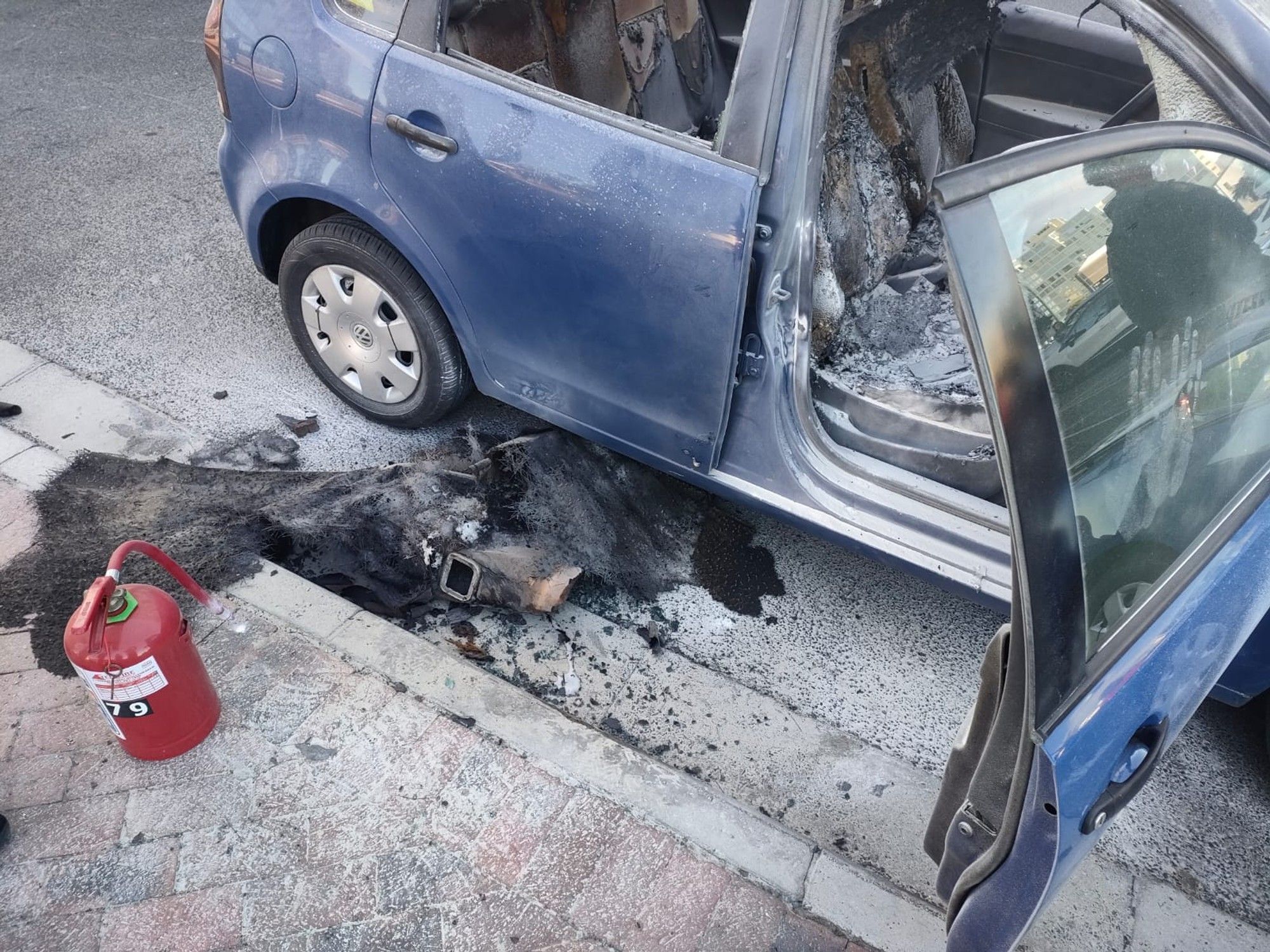 Two children rushed to hospital after vehicle catches fire in Strand
