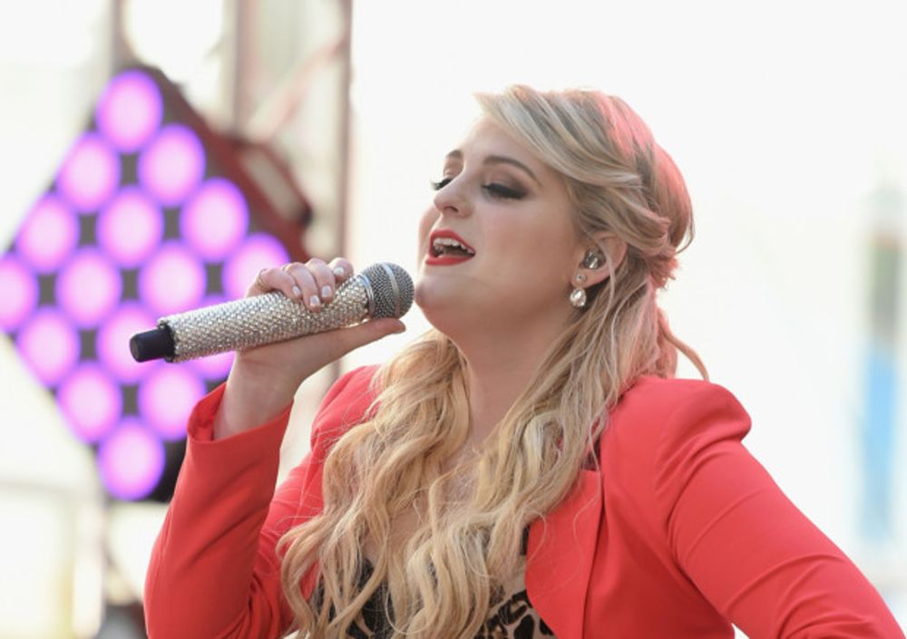 Singer toned down, kicks up heels