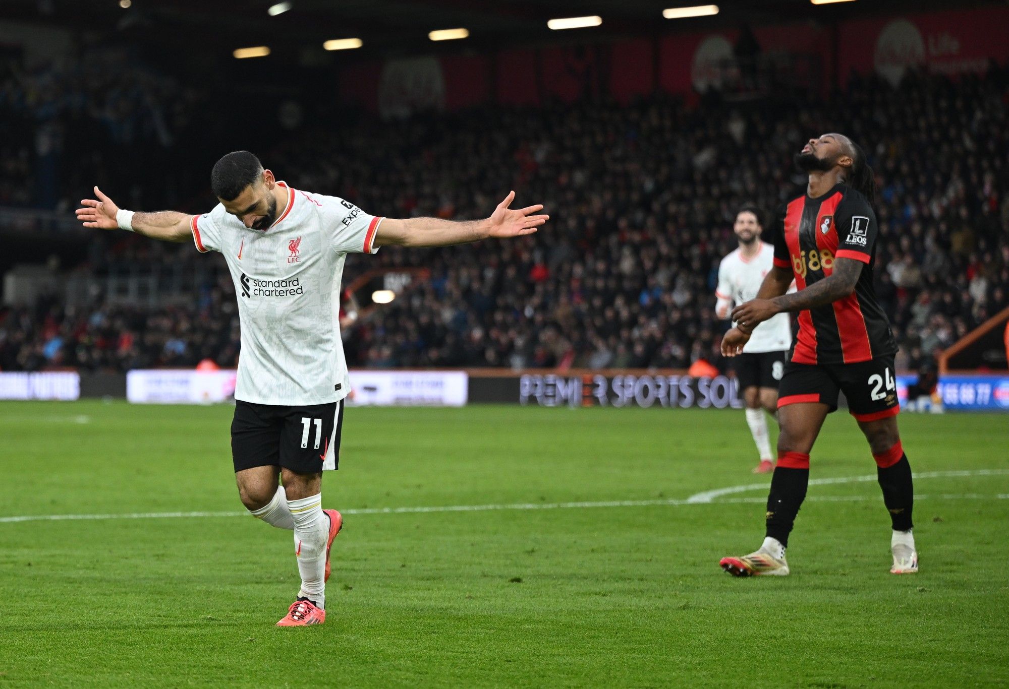 Liverpool stretch lead with controversial Salah penalty, while Forest ...