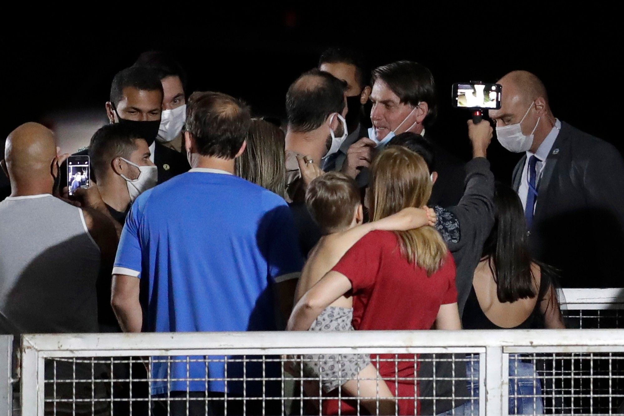Brazil's Bolsonaro removes mask in public after coronavirus recovery