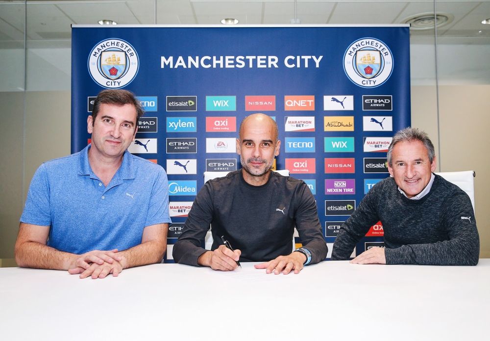 Manchester City's Guardiola extends contract to 2023