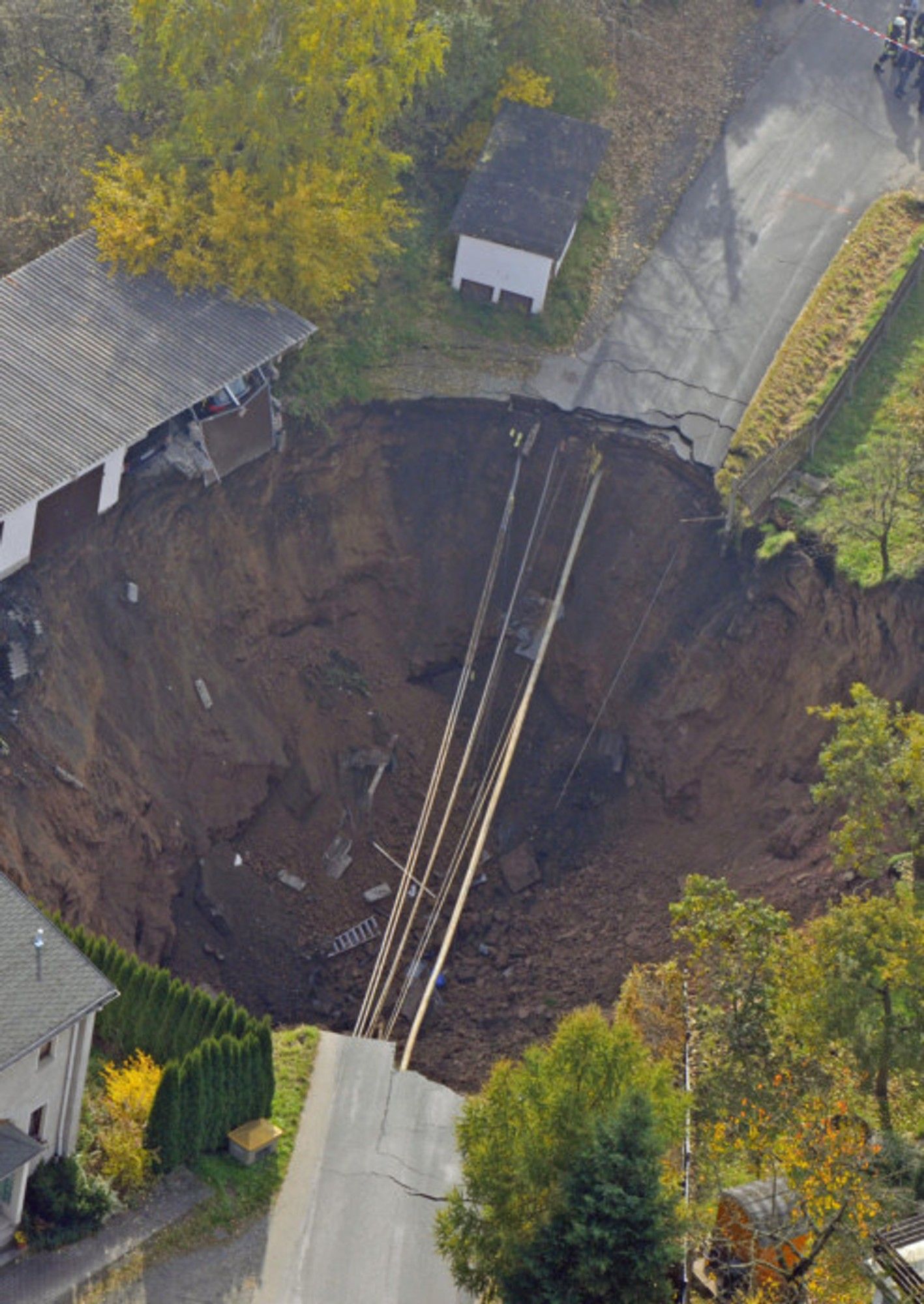 Giant pothole swallows car in Germany