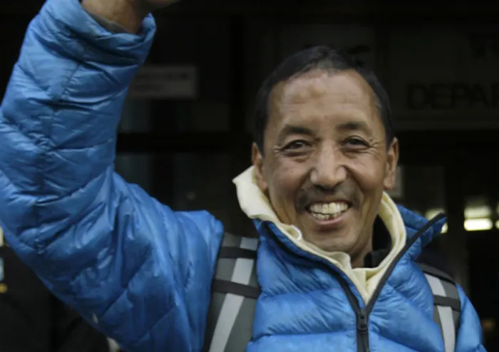 Sherpa climbs Everest for record 21st time