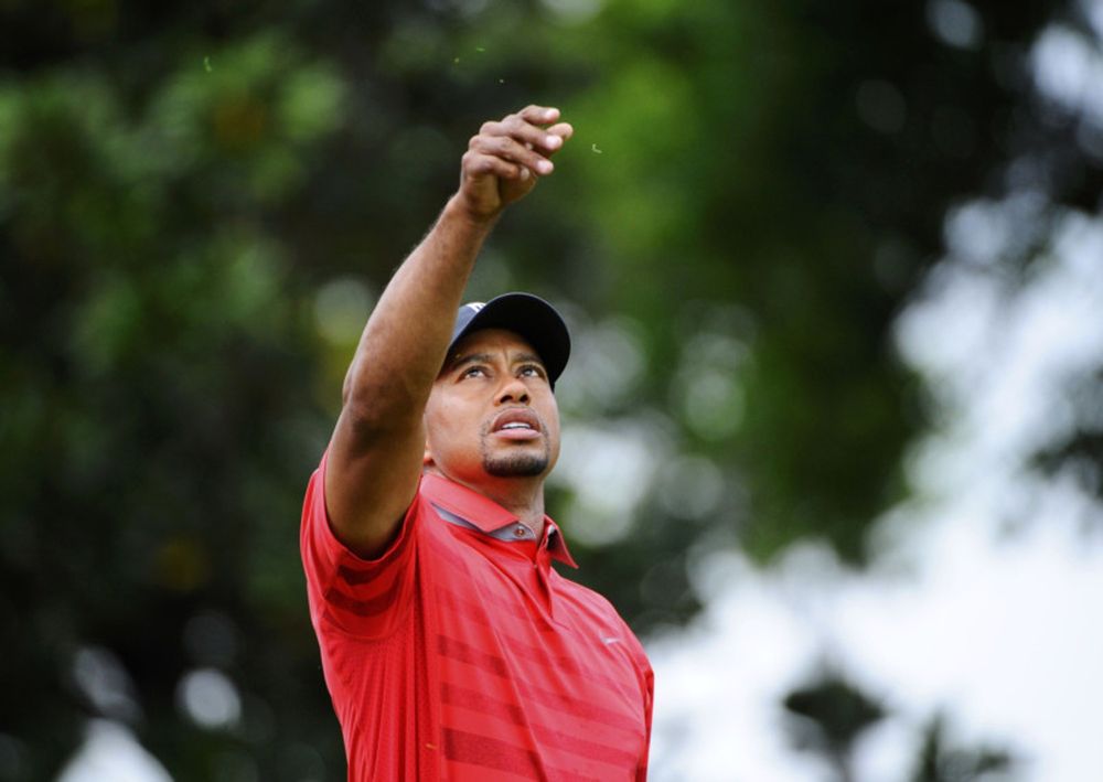 Thunderstorm halts Woods’ push