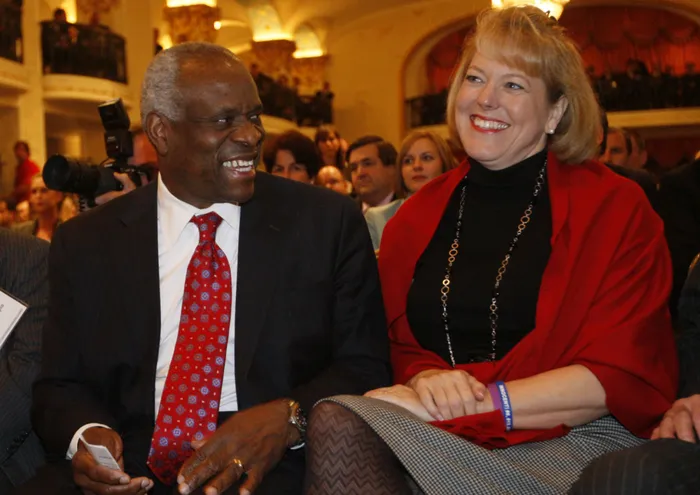 Justice Thomas' wife calls husband's accuser