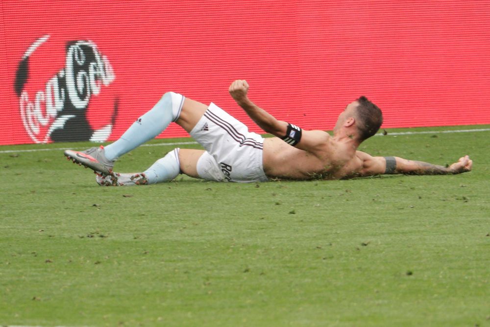 Aspas strikes late to blunt Barca's title bid