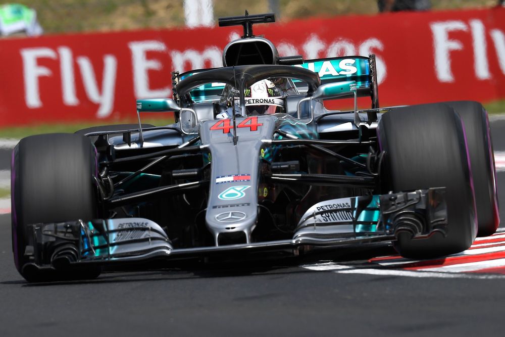 Hamilton dances in the rain to take pole in Mercedes lockout