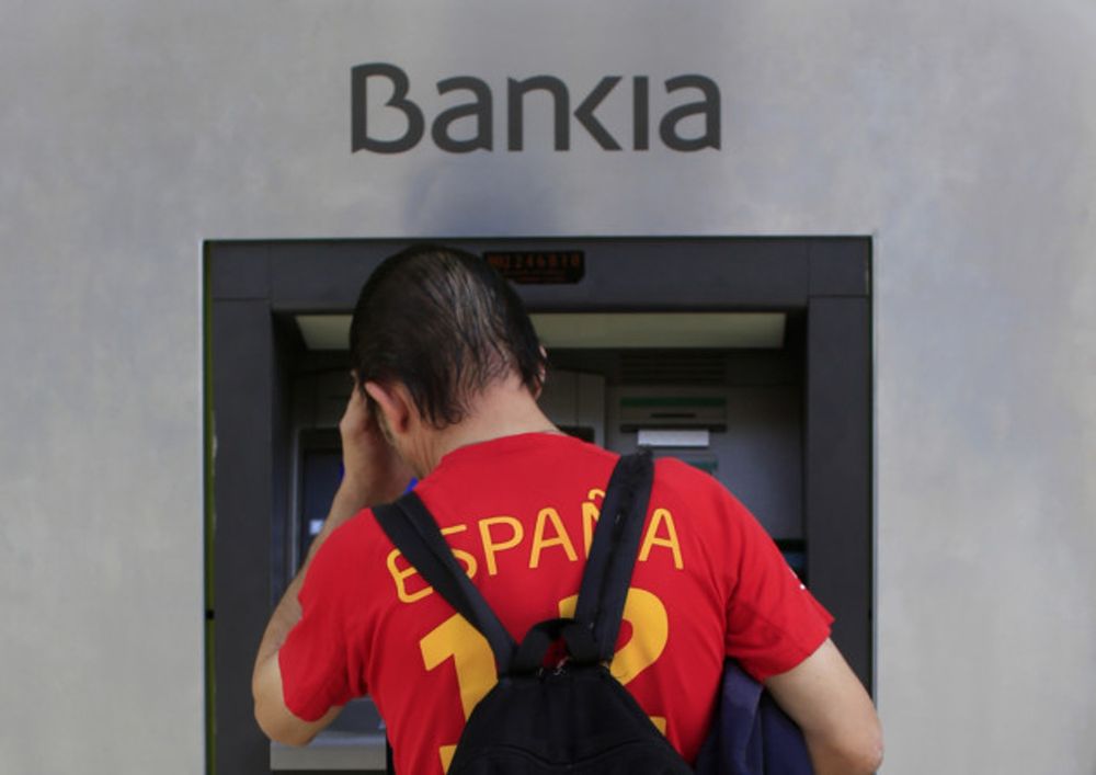 Spain makes small profit on Bankia stake sale
