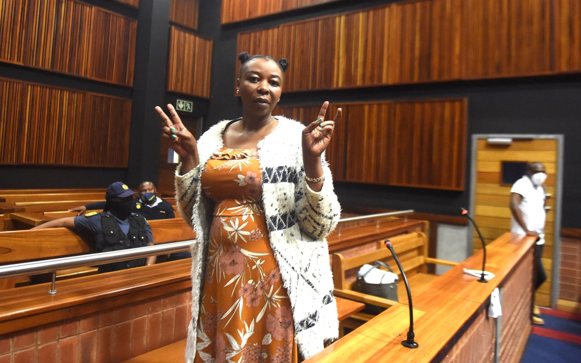 Ex-cop accused of plotting to kill six family members displays bizarre behaviour prior to hearing