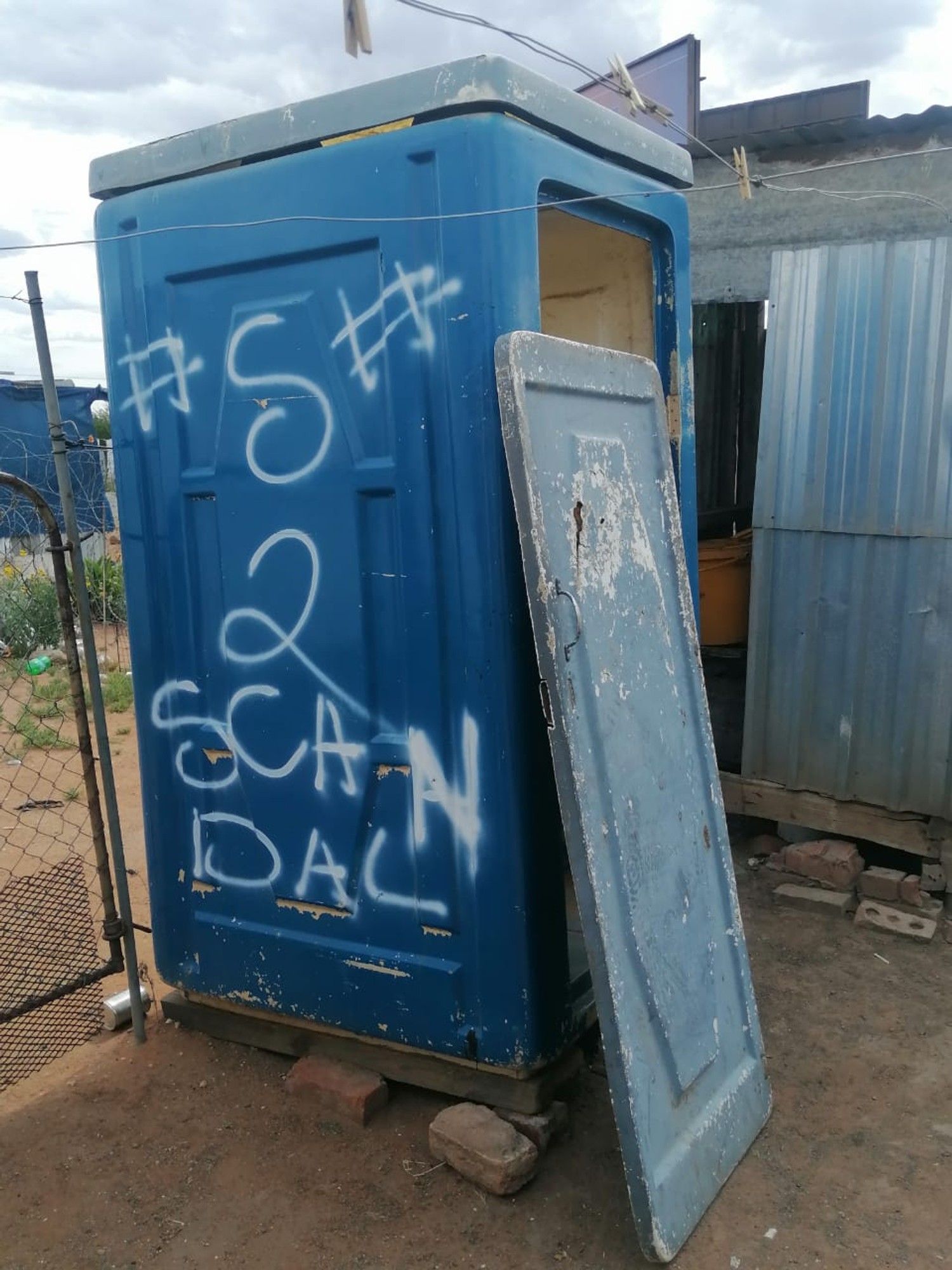 Residents raise a stink over bucket toilets