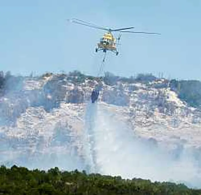 Helicopters brought in to fight raging fire