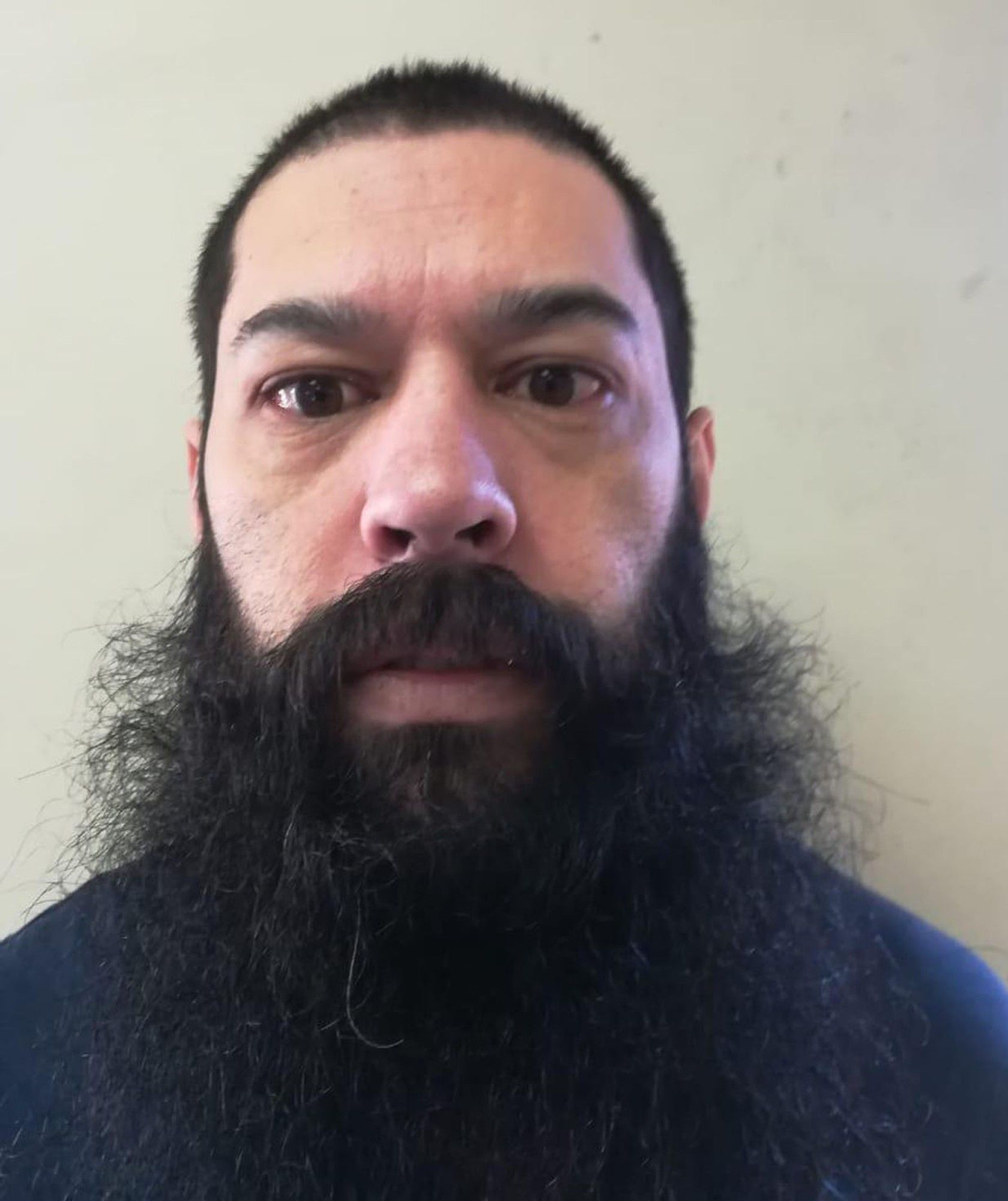 PICS: Wanted Cape Town man caught hiding in secret room in cupboard