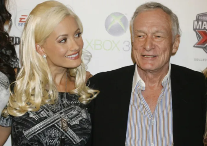 Tycoon pays $30k for seat next to Holly Madison