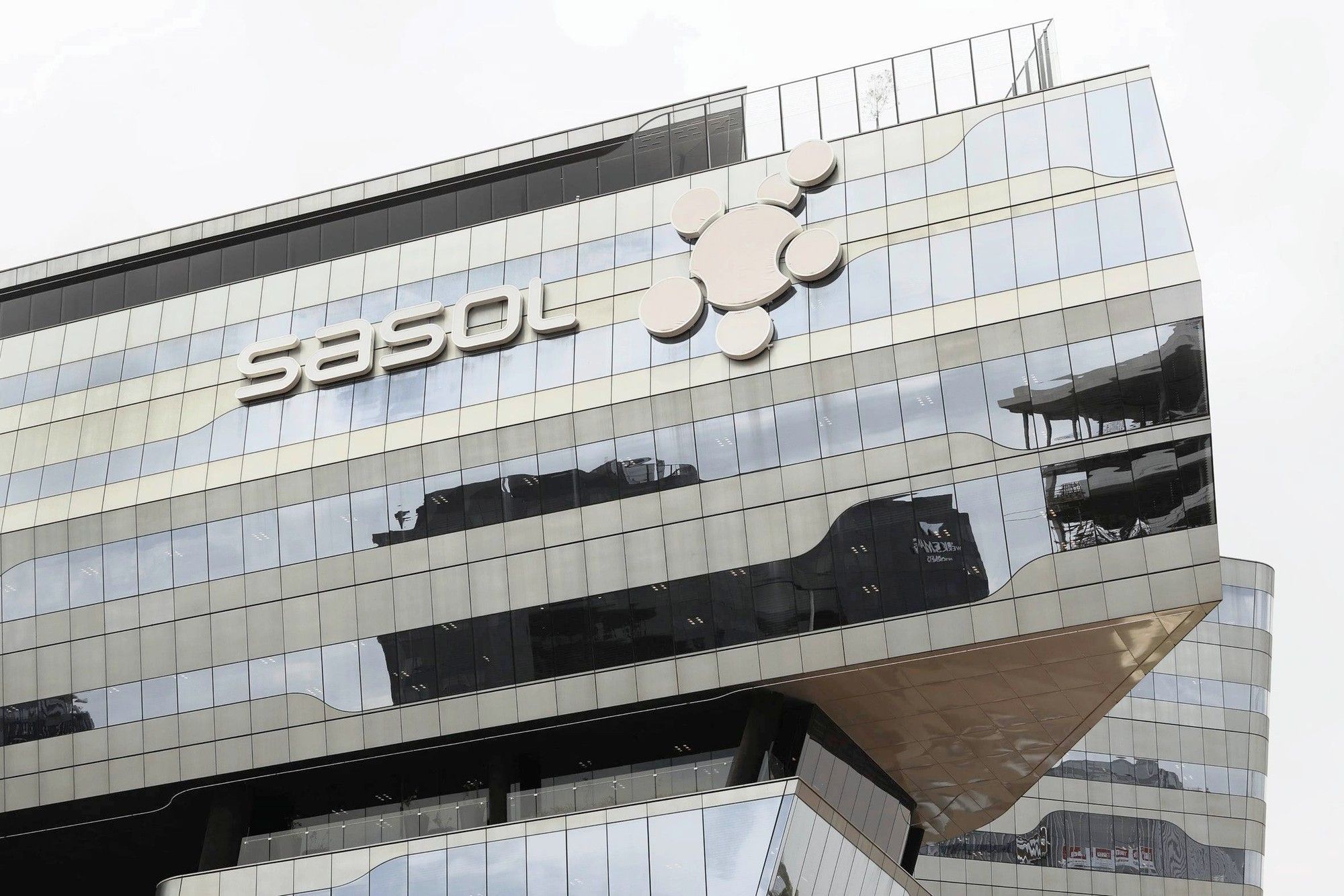 Sasol shares dive after revised costs