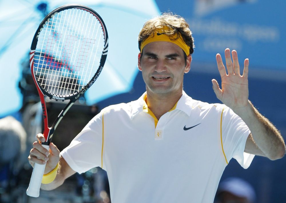 Federer raises his game